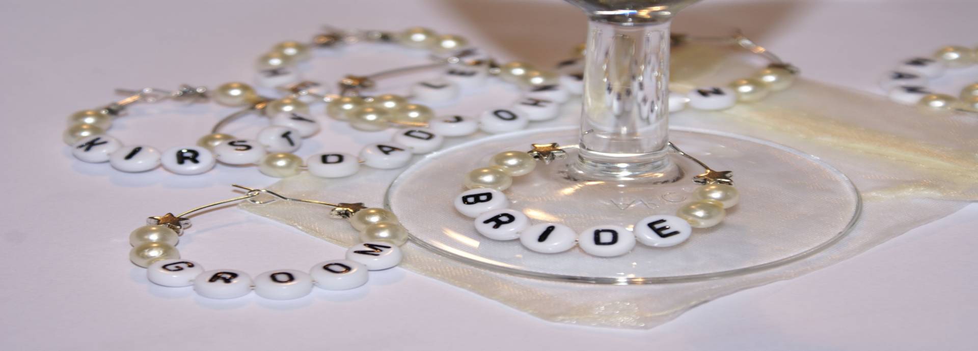 Jazz up your tables with personalised wine glass charms | Guides for Brides